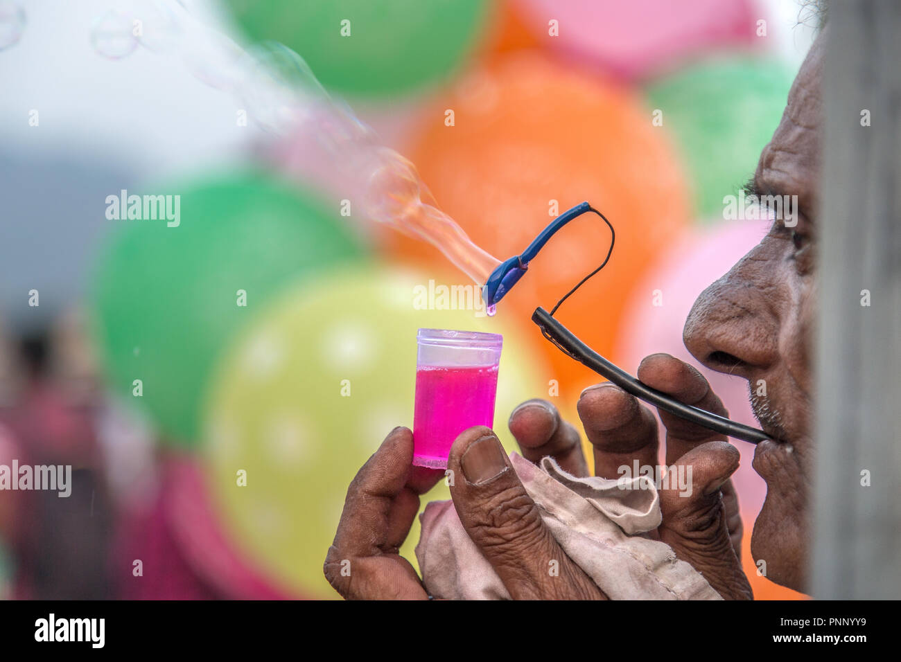 Indian man blowing bubbles hi-res stock photography and images - Alamy