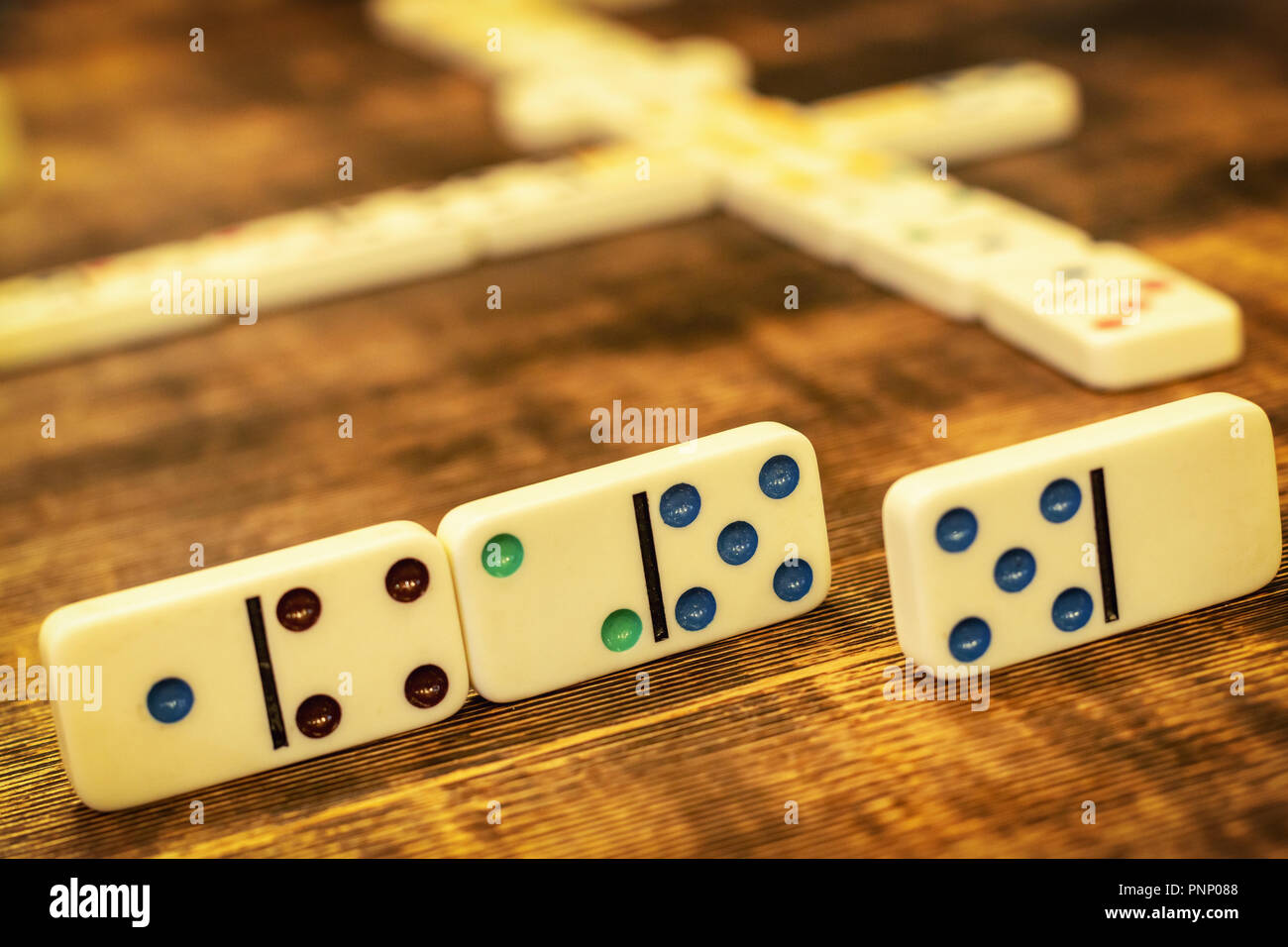 Dominoes tiles on vintage table detail Stock Photo - Alamy