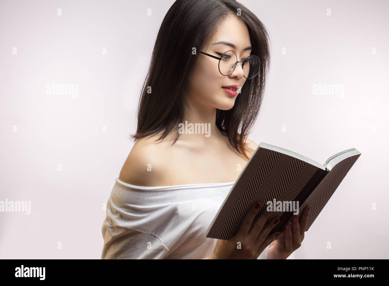 Asian student female reading book on white background isolated at ...