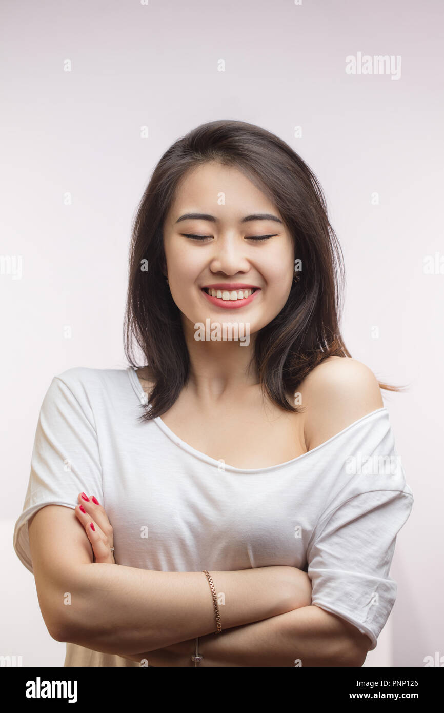 Young happy Asian woman smiling and feels happy, posing isolated over ...