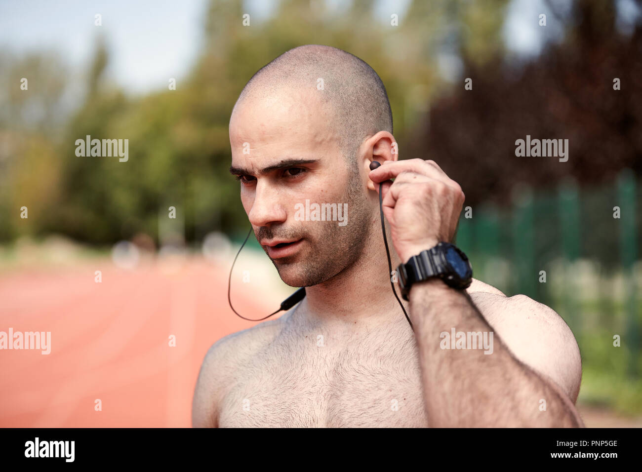 one young shirtless strong muscular man, 30-35 years, side view, head ...