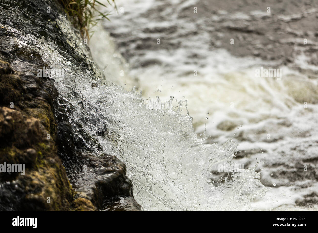 Raging river water passing a waterfall Stock Photo - Alamy