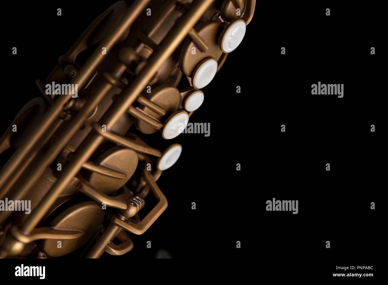 Matte finish saxophone with pearl keys on black background Stock Photo ...
