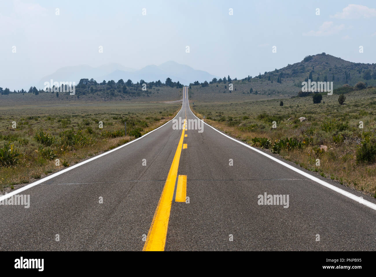 A long road going into the distance Stock Photo - Alamy