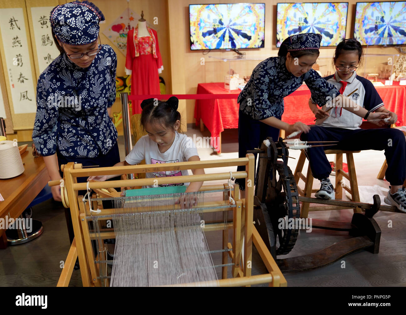 Shanghai, China. 21st Sep, 2018. Pupils learn to operate the ...