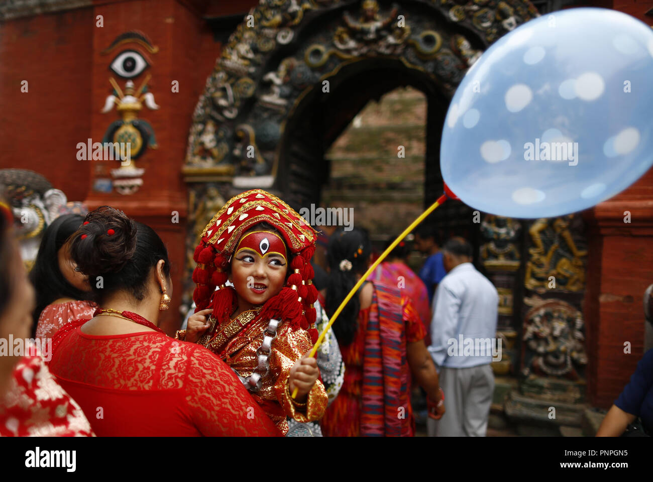Kathmandu, Nepal. 22nd Sep, 2018. A girl adorned as a Living Goddess is ...
