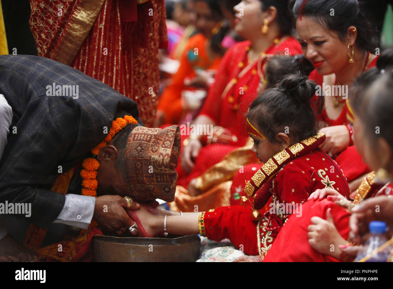 Kathmandu, Nepal. 22nd Sep, 2018. A girl attends the procession of ...