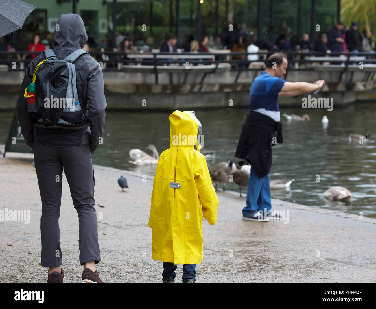 London,22nd September 2018,A child wears a yellow raincoat with an ...
