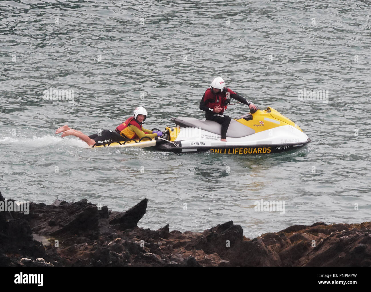 Beach lifeguard assisits newquay lifeboat hi-res stock photography and ...