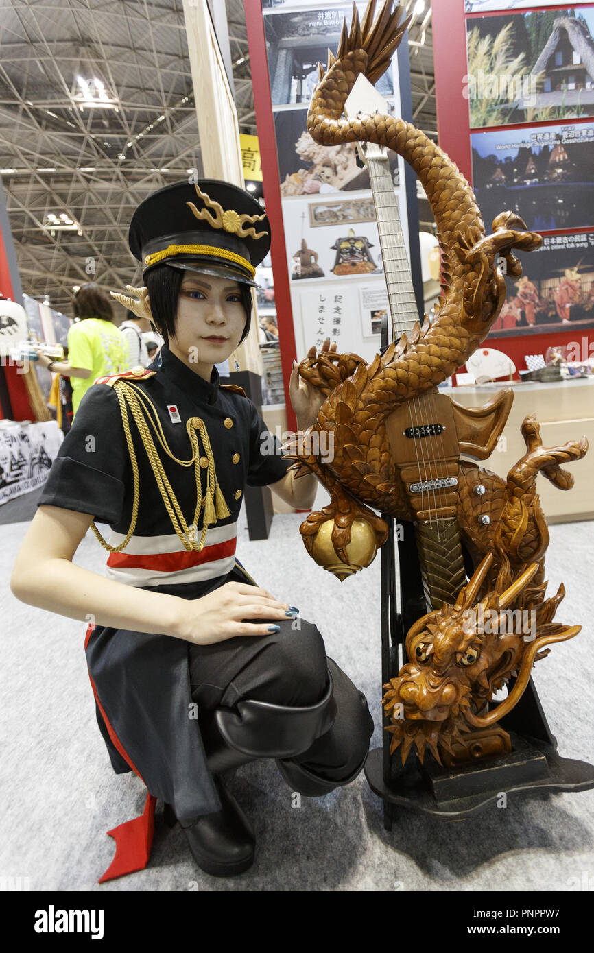 Tokyo, Japan. 22nd Sep, 2018. A booth assistant poses for a photograph ...