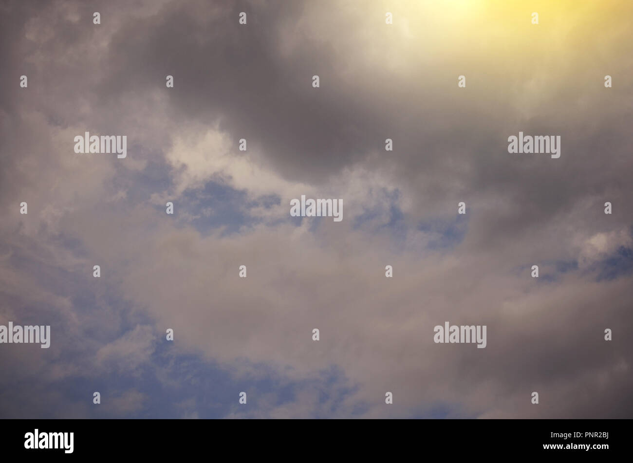 Nature background. Fluffy soft clouds in sky toned Stock Photo - Alamy