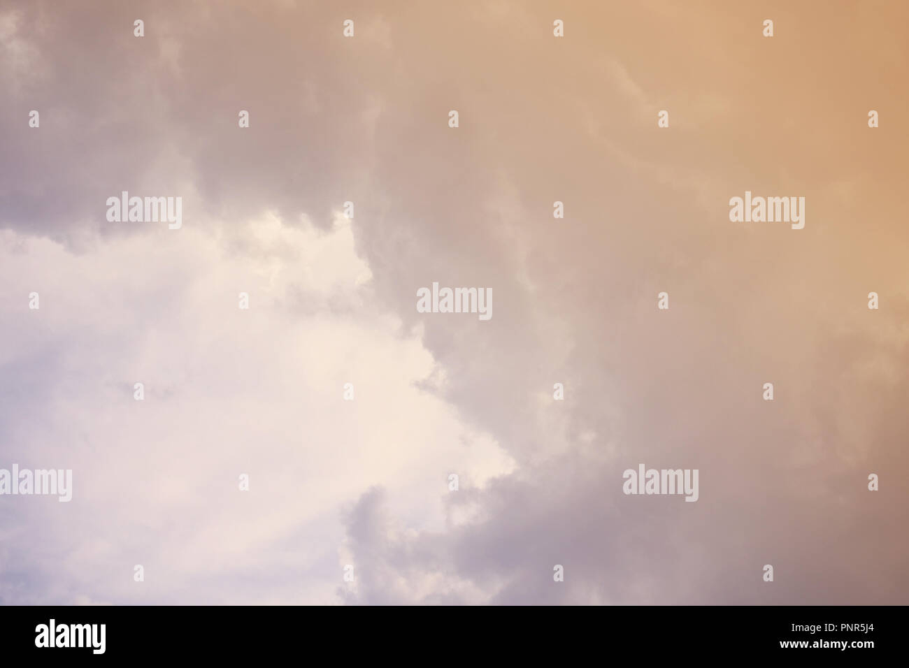 Nature background. Fluffy soft clouds in sky toned Stock Photo - Alamy
