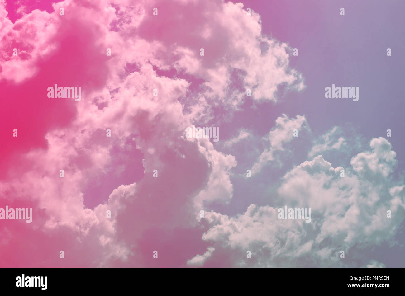 Nature background. Fluffy soft clouds in sky toned Stock Photo - Alamy