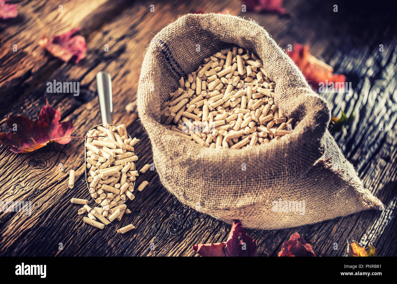 Wooden pressed pellets from biomass in old sack Stock Photo - Alamy
