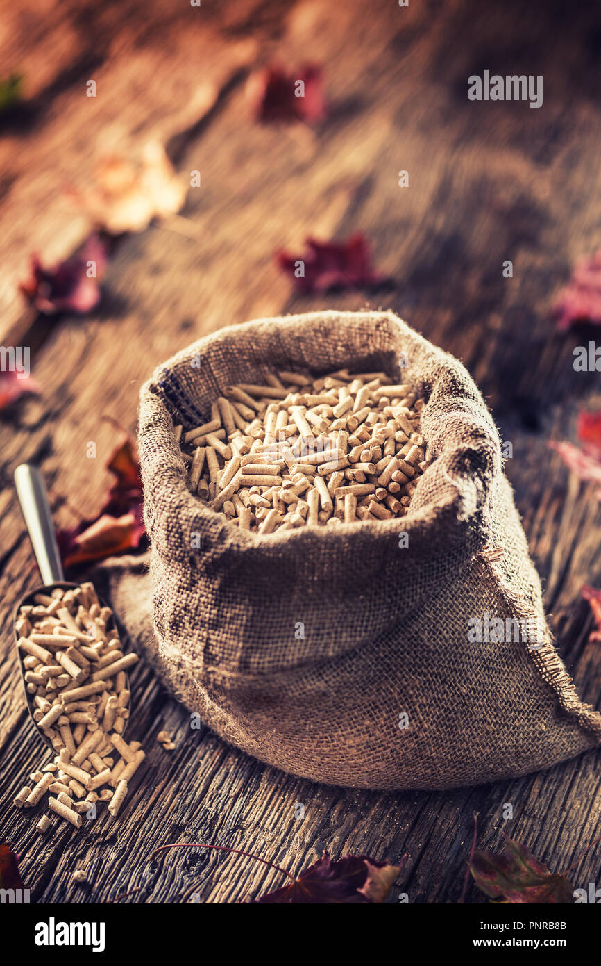 Wooden pressed pellets from biomass in old sack Stock Photo - Alamy