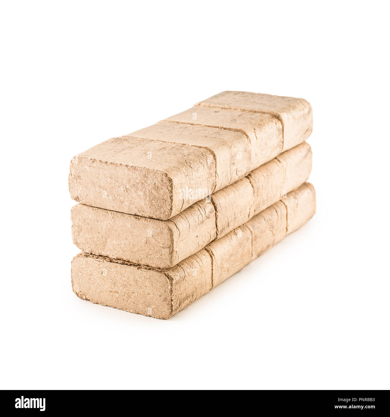 Wooden pressed briquettes from biomass on a white isolated background ...