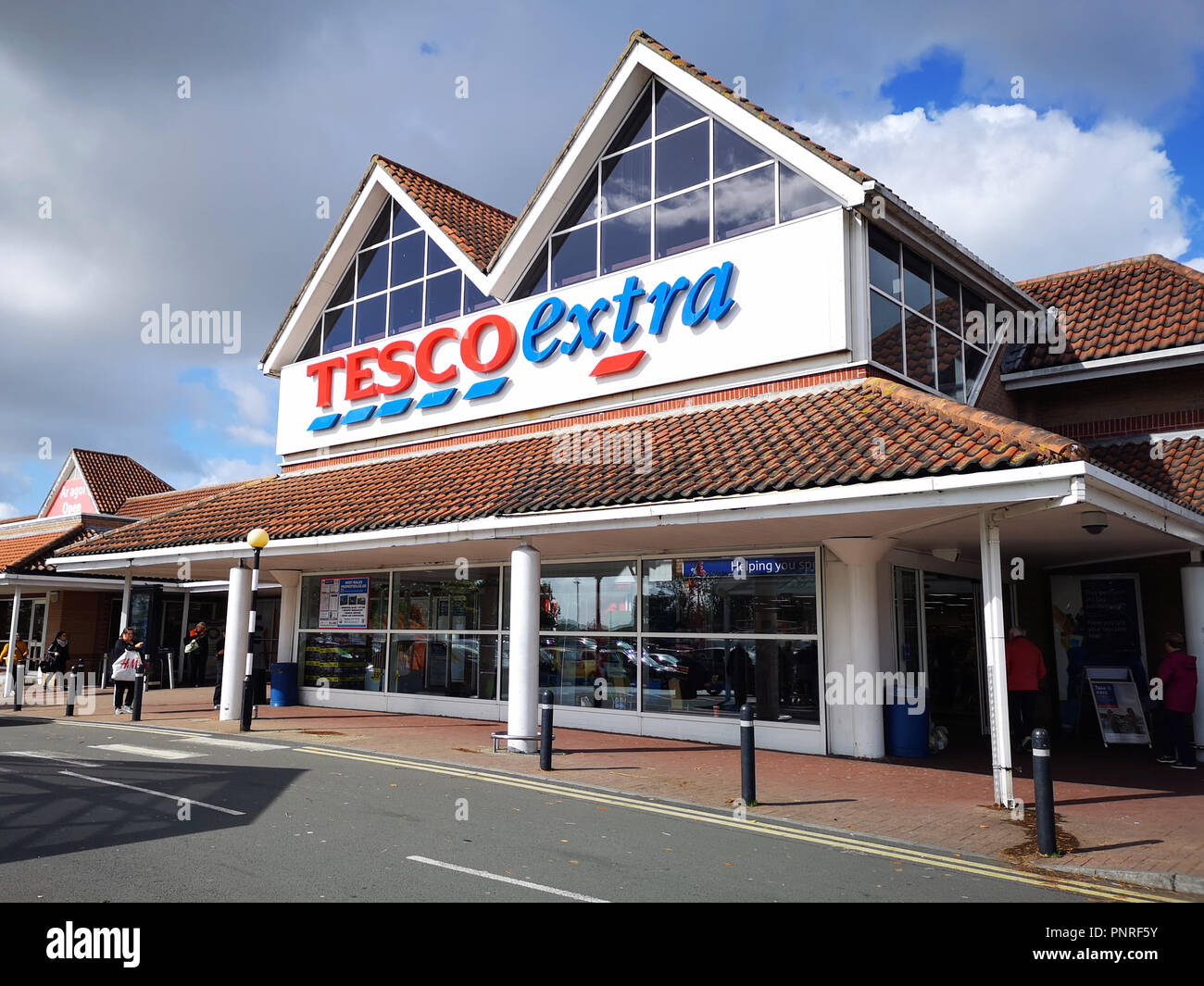 Llanelli, UK: September, 2018: Customers enter a Tesco Extra superstore ...