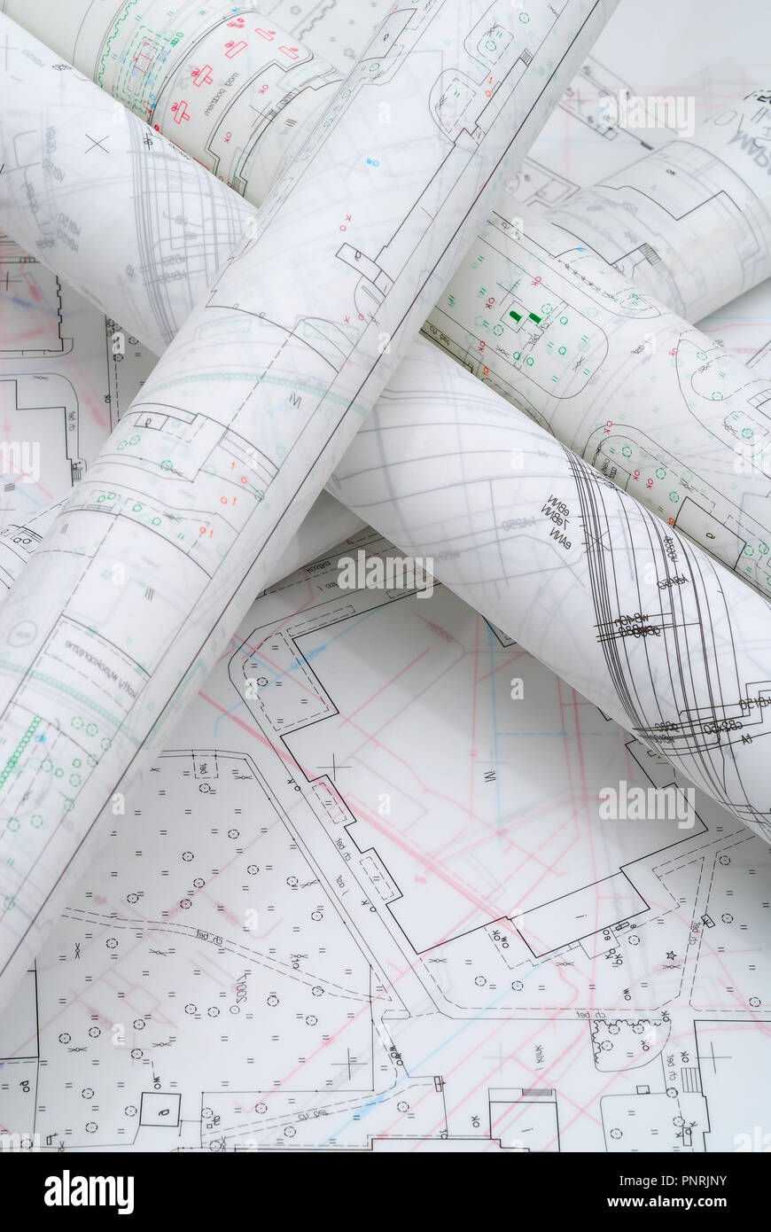 Rolled architectural plans lying on drawing board Stock Photo - Alamy