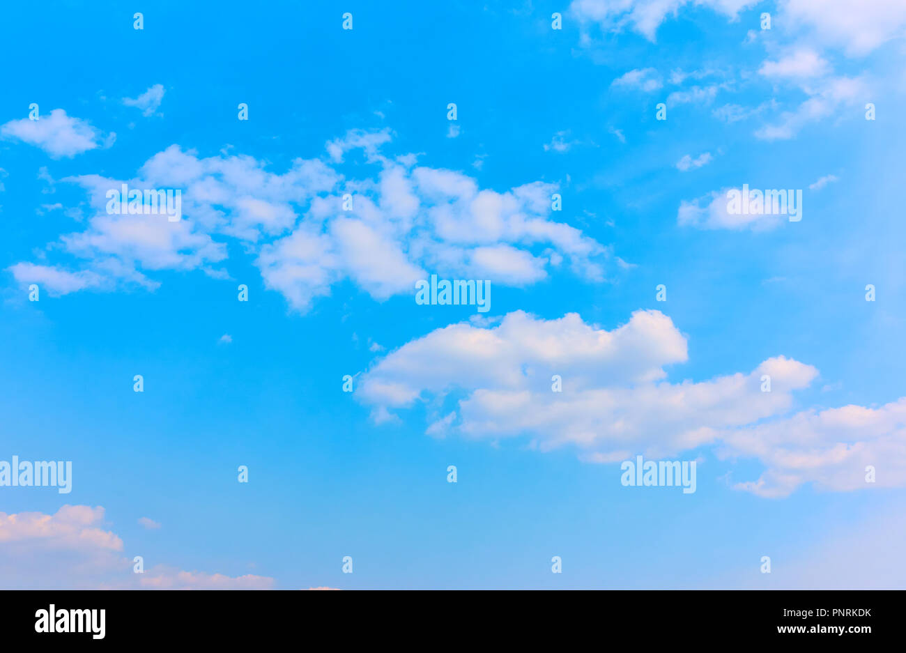 Light blue sky with white clouds - background with large space for your ...