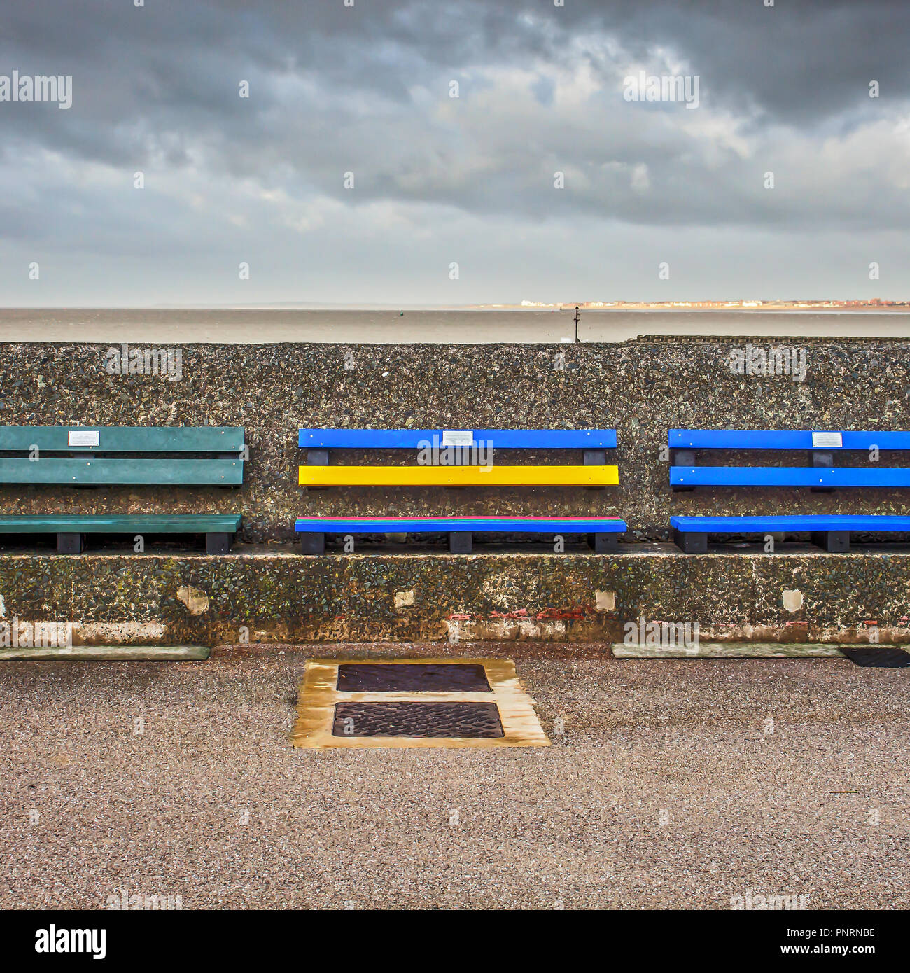 Three colourful benches on promenade, New Brighton, UK Stock Photo - Alamy