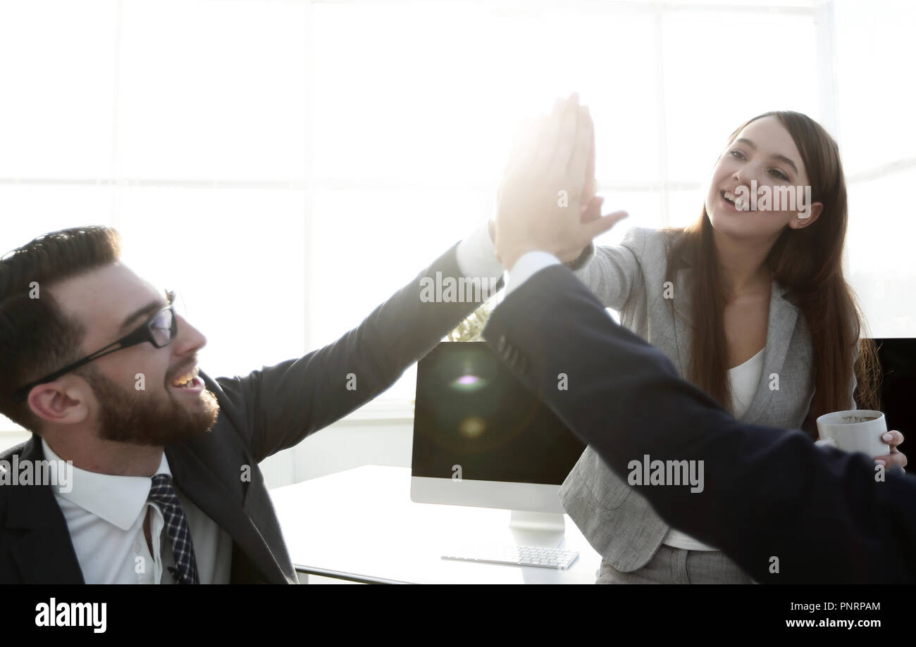 business team giving each other a high five Stock Photo - Alamy