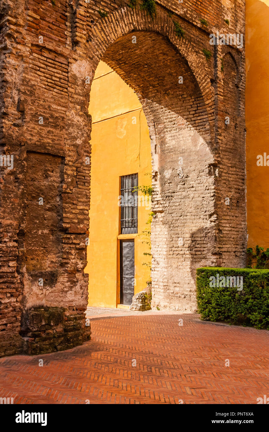 Ancient brick archway at the entrance to the Reales Alcazares, Seville ...