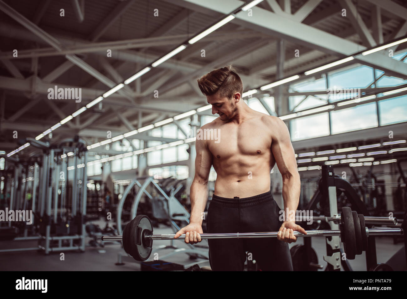 Muscular man flexing in wellness hi-res stock photography and images ...