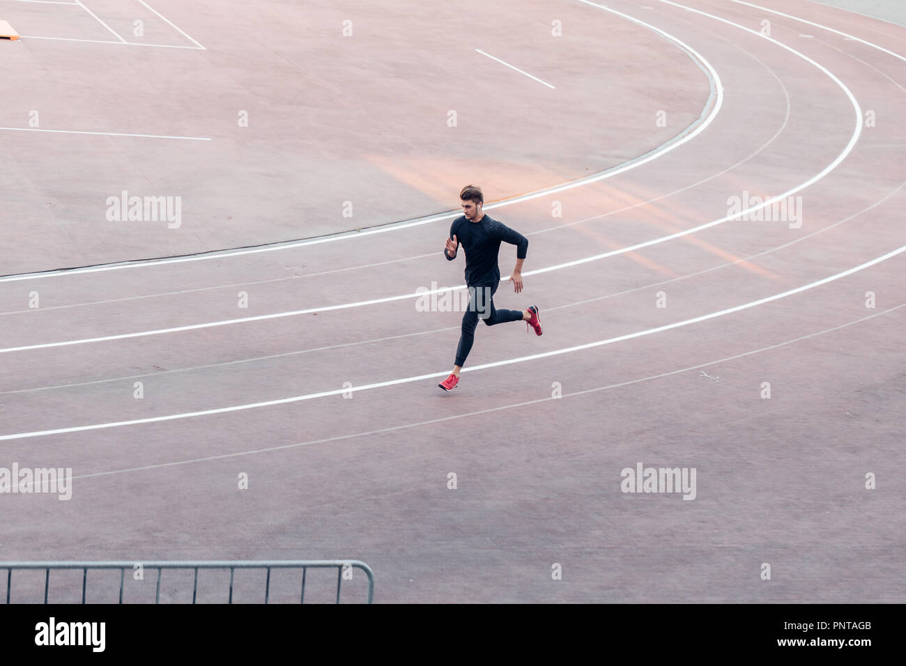 Male sprinter in blocks hi-res stock photography and images - Alamy