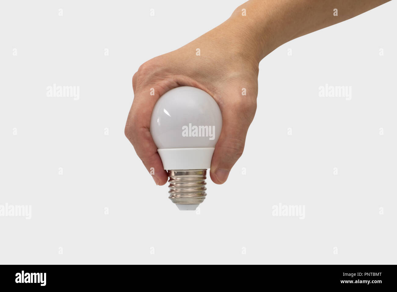 Hand holding a light bulb shape isolated on white background Stock ...