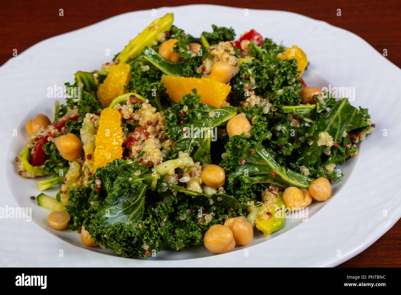 Salad with kinoa and orange Stock Photo - Alamy