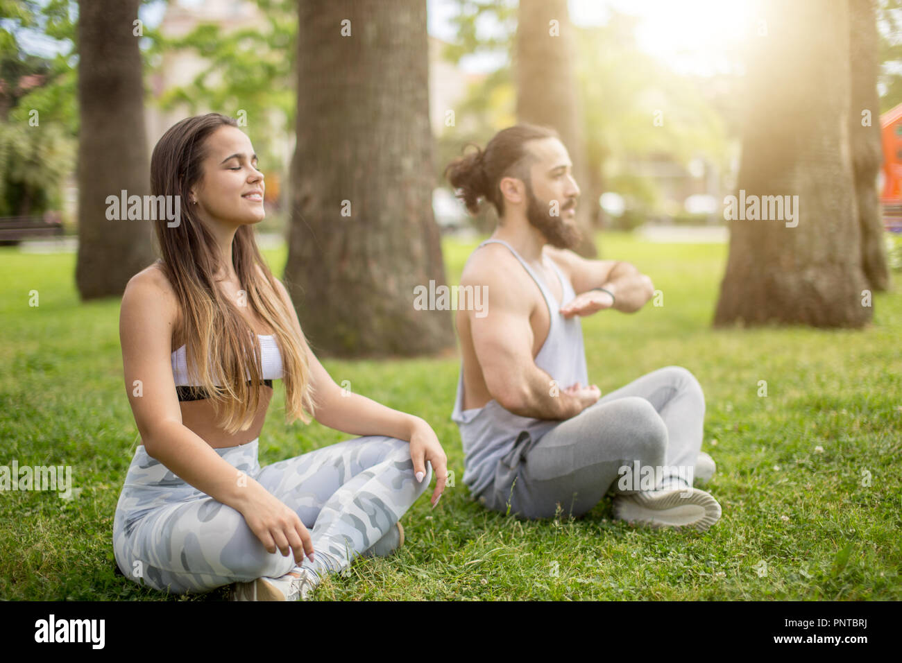 Young attractive couple acro yoga hi-res stock photography and images ...