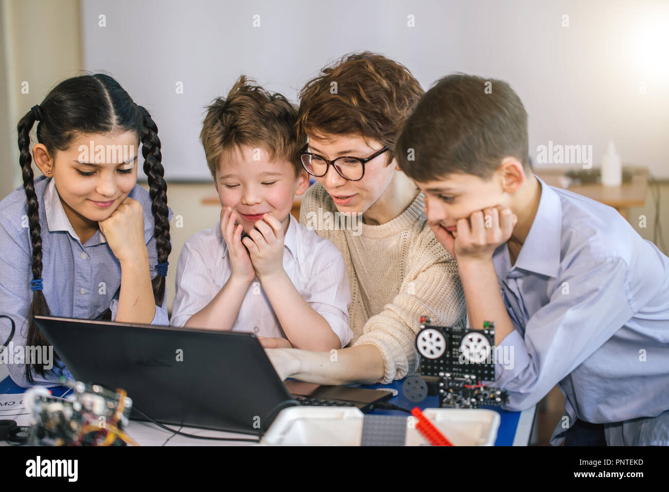 Curious children learn programming using laptops on extracurricular ...