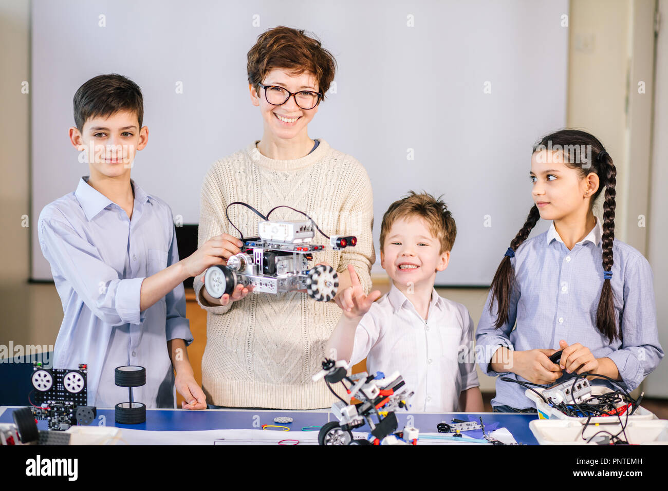 Happy children learn programming using laptops on extracurricular ...