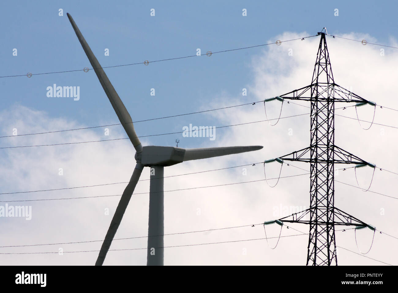 Close up of modern electric post and wind turbine Stock Photo - Alamy