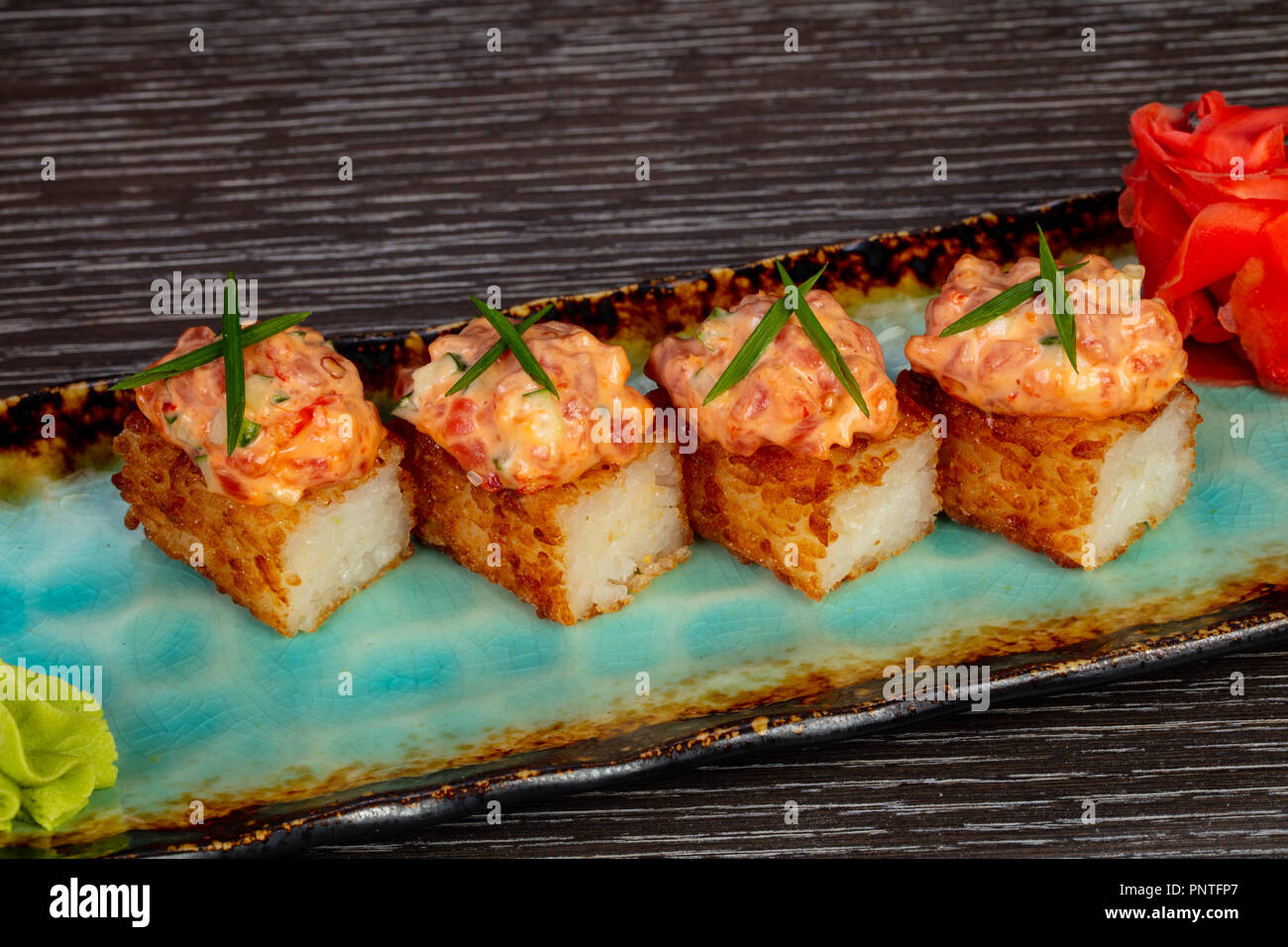Crispy rice roll with tuna and wasabi Stock Photo - Alamy