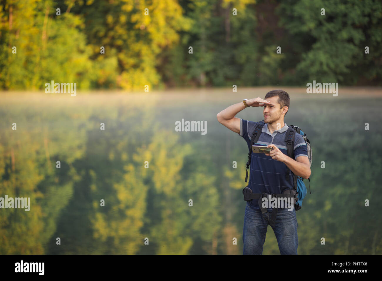 Male searching phone backpack hi-res stock photography and images - Alamy
