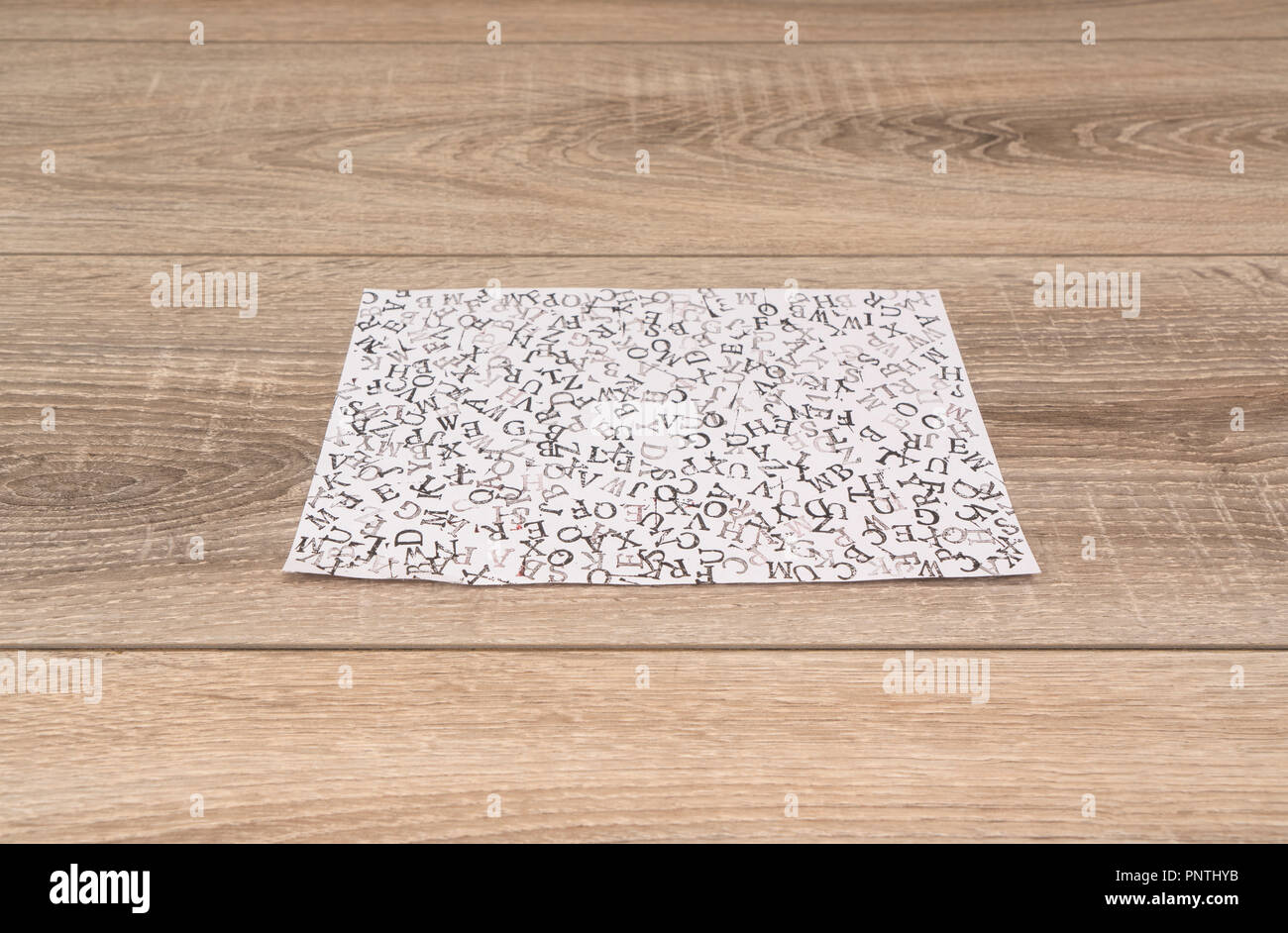 a sheet of paper with the letters of the alphabet arranged randomly ...