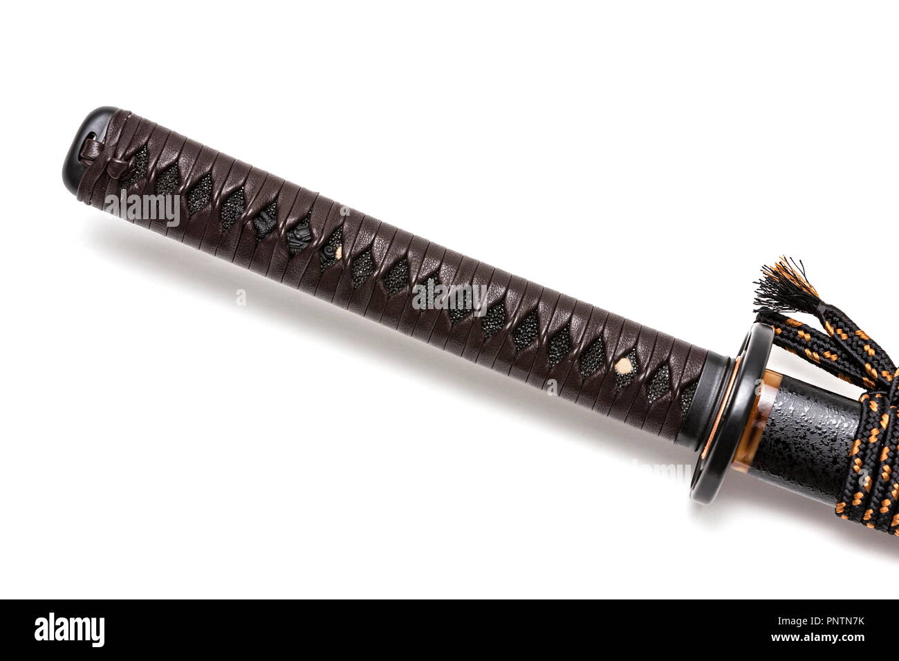 Tsuka: Handle of Japanese sword isolated in white background. Black ...