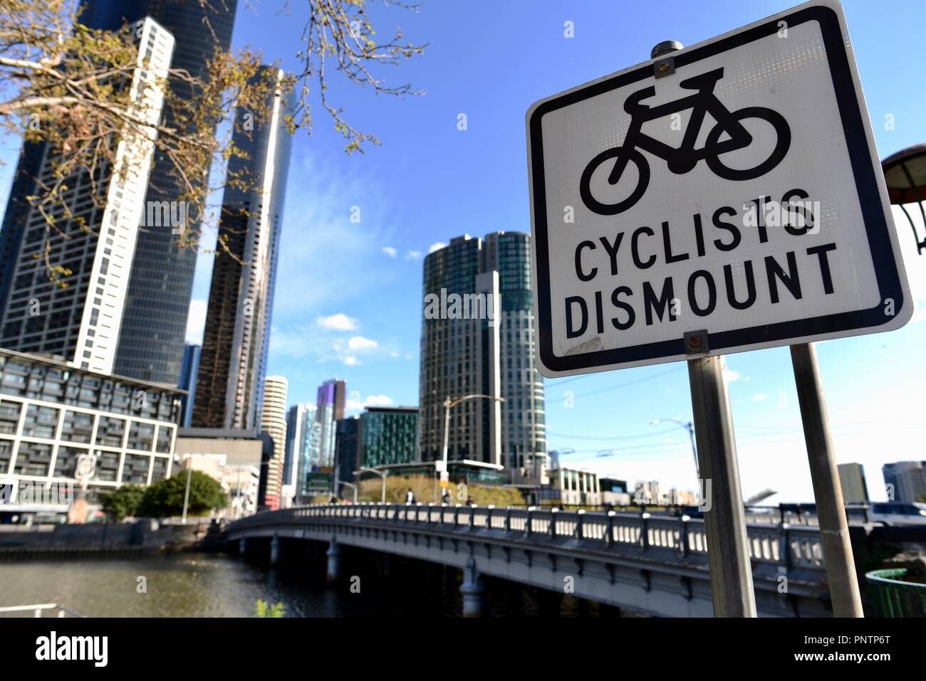 Cyclists dismount sign, Melbourne VIC, Australia Stock Photo - Alamy