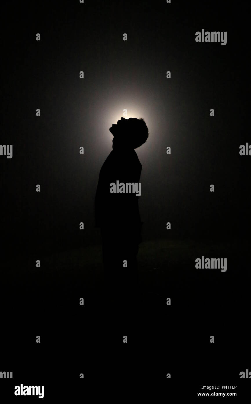 Silhouette in the Dark, Head Leaning Backwards with Open Mouth. Light ...