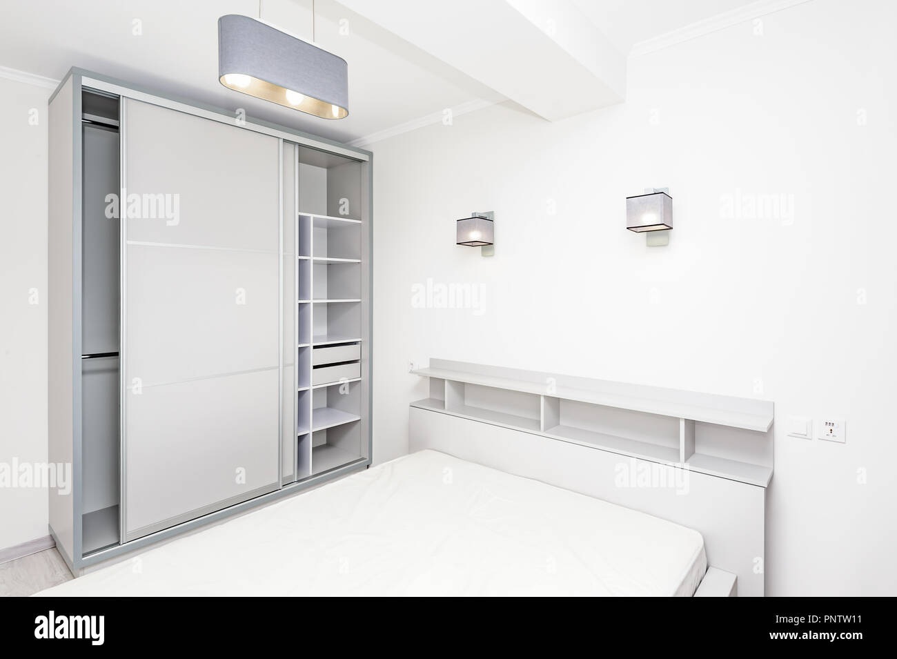 Simple white empty bedroom interior Stock Photo - Alamy