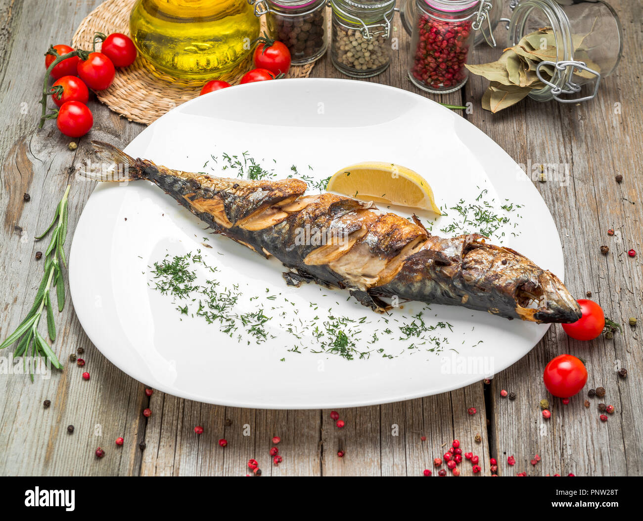 Oktoberfest menu. Grilled mackerel fish with beer and pretzel served ...