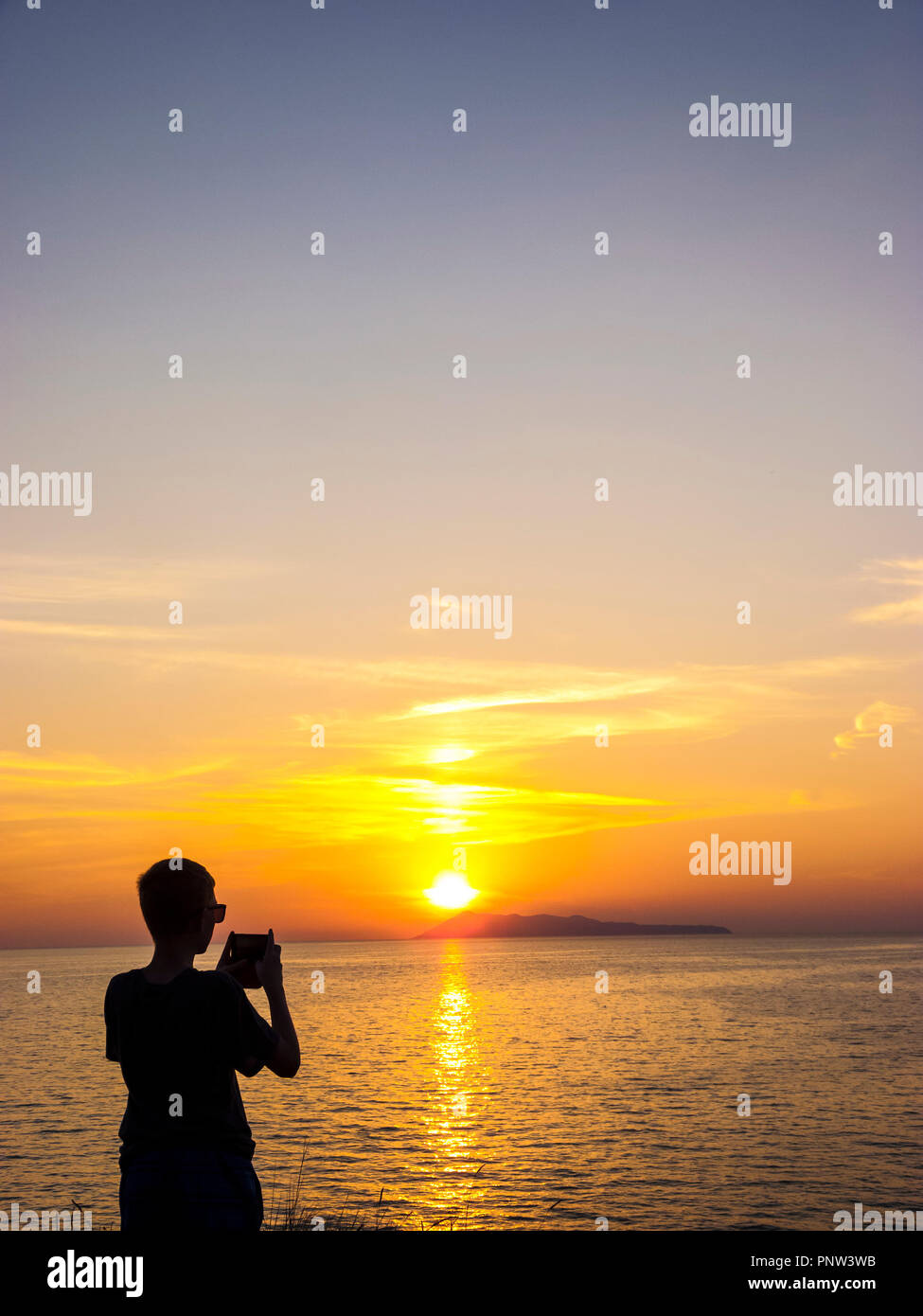 Corfu island, Greece - August 22 2018: Beautiful sunset at Logas beach ...