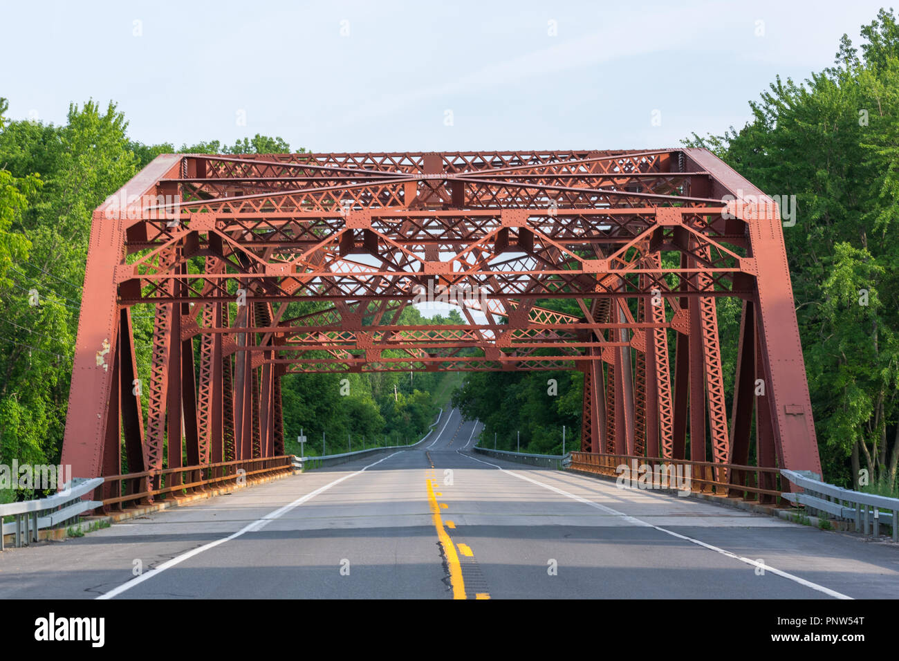 A roadway over a bridge as it winds its way up a hill Stock Photo - Alamy