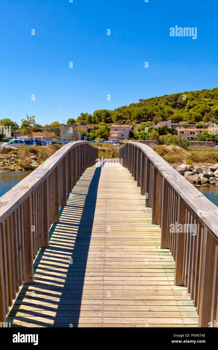 Wooden bridge over a water inlet directly to the Mediterranean Sea at ...