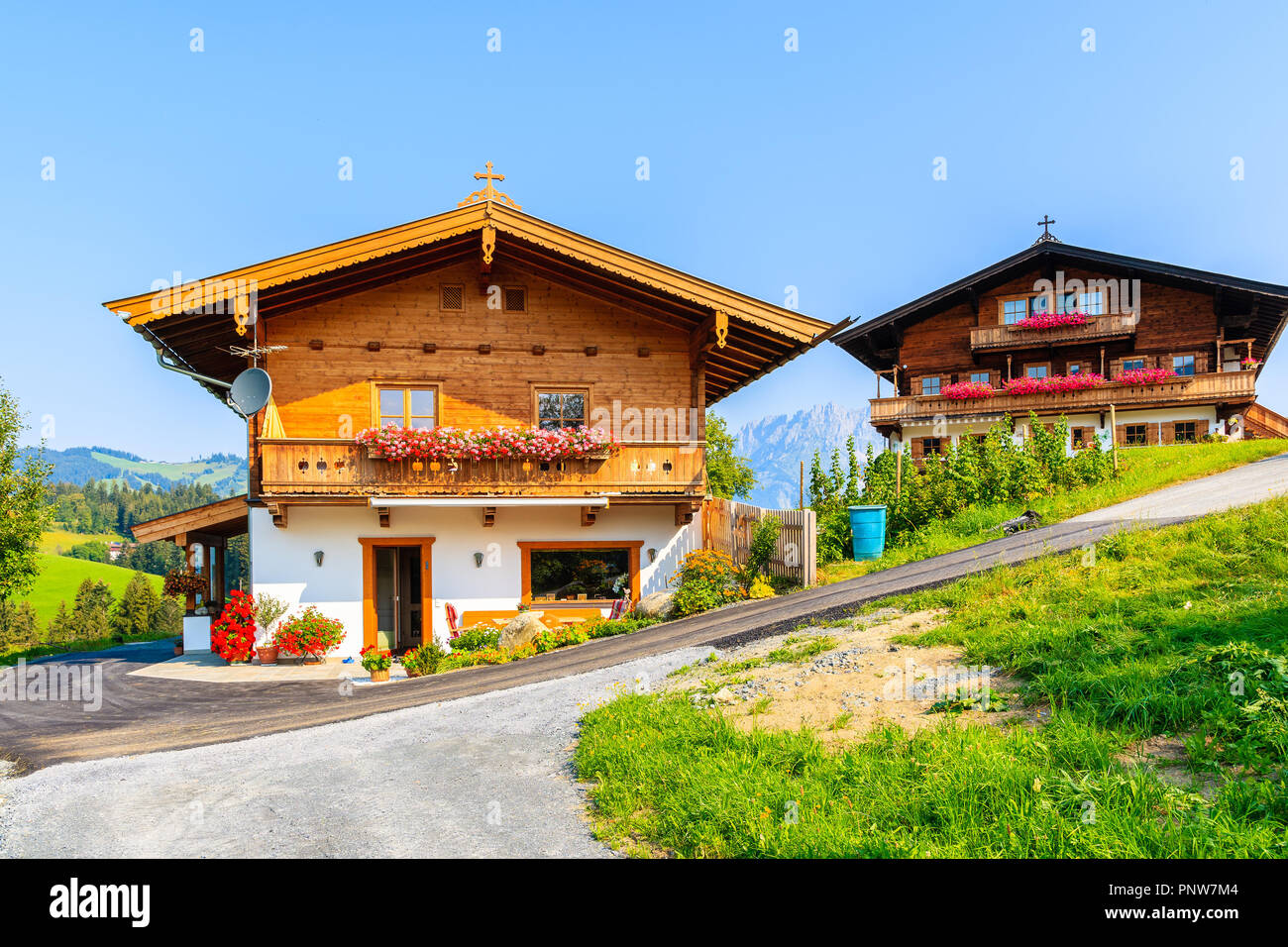 Traditional houses on green meadow in Gieringer Weiher mountain area ...