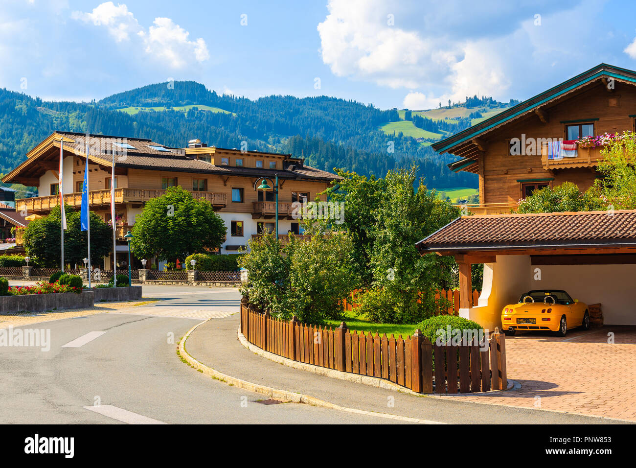 Typical alpine houses on street in Reith bei Kitzbuhel village in Alps ...