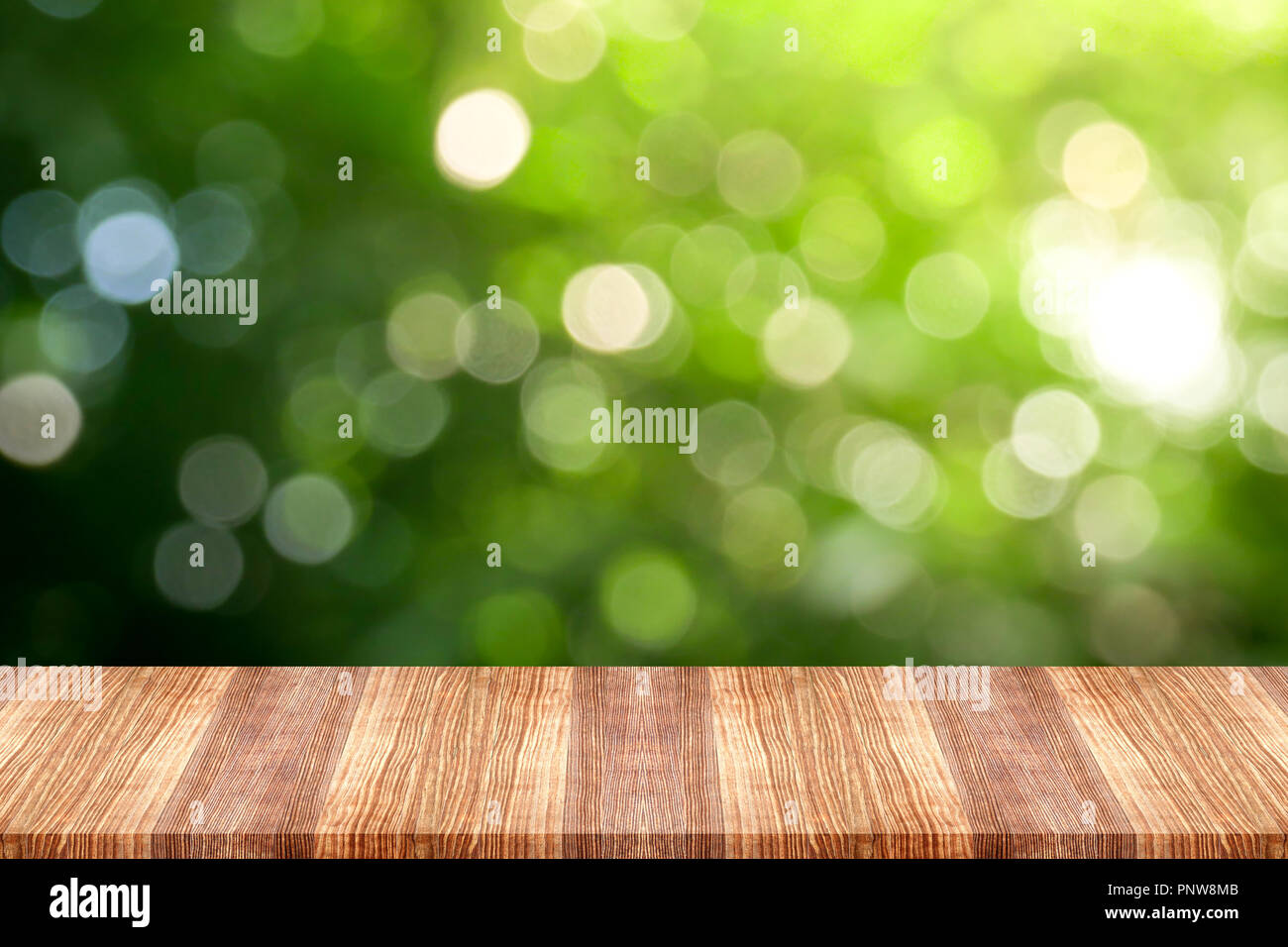 Wooden table top on green nature background Stock Photo - Alamy