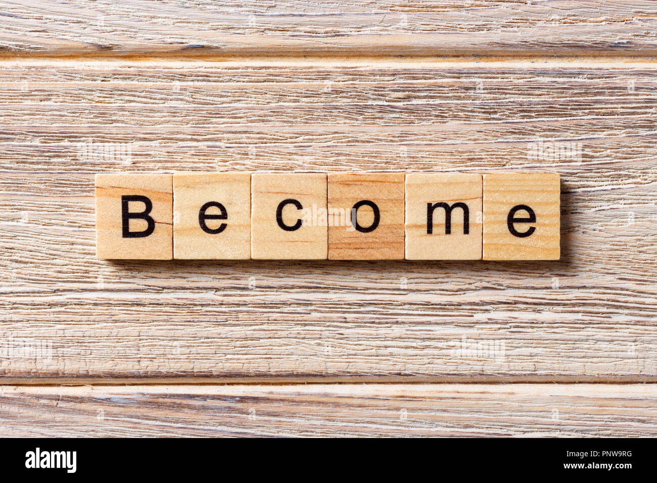 Become word written on wood block. Become text on table, concept Stock ...