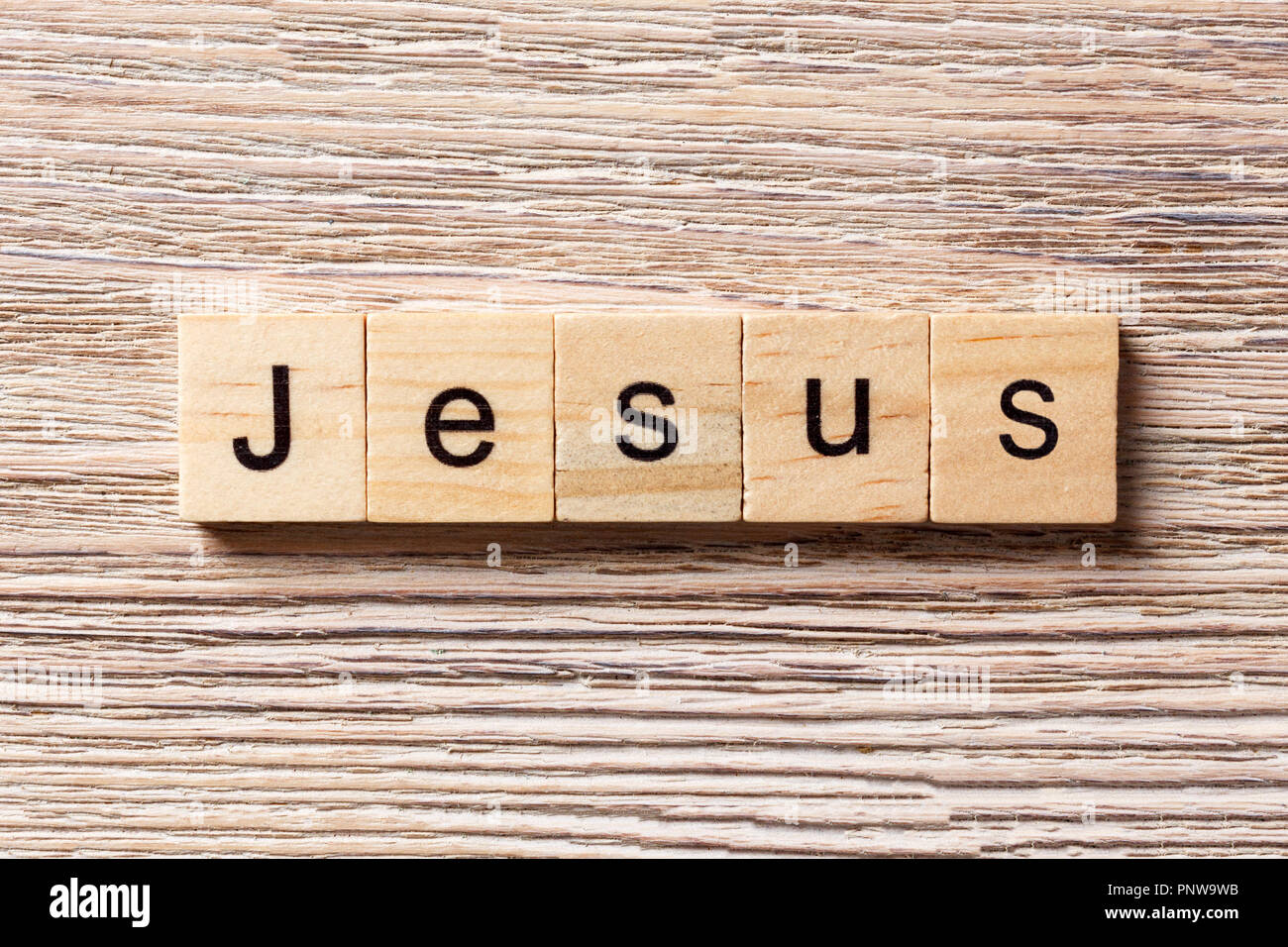 Jesus word written on wood block. Jesus text on table, concept Stock ...